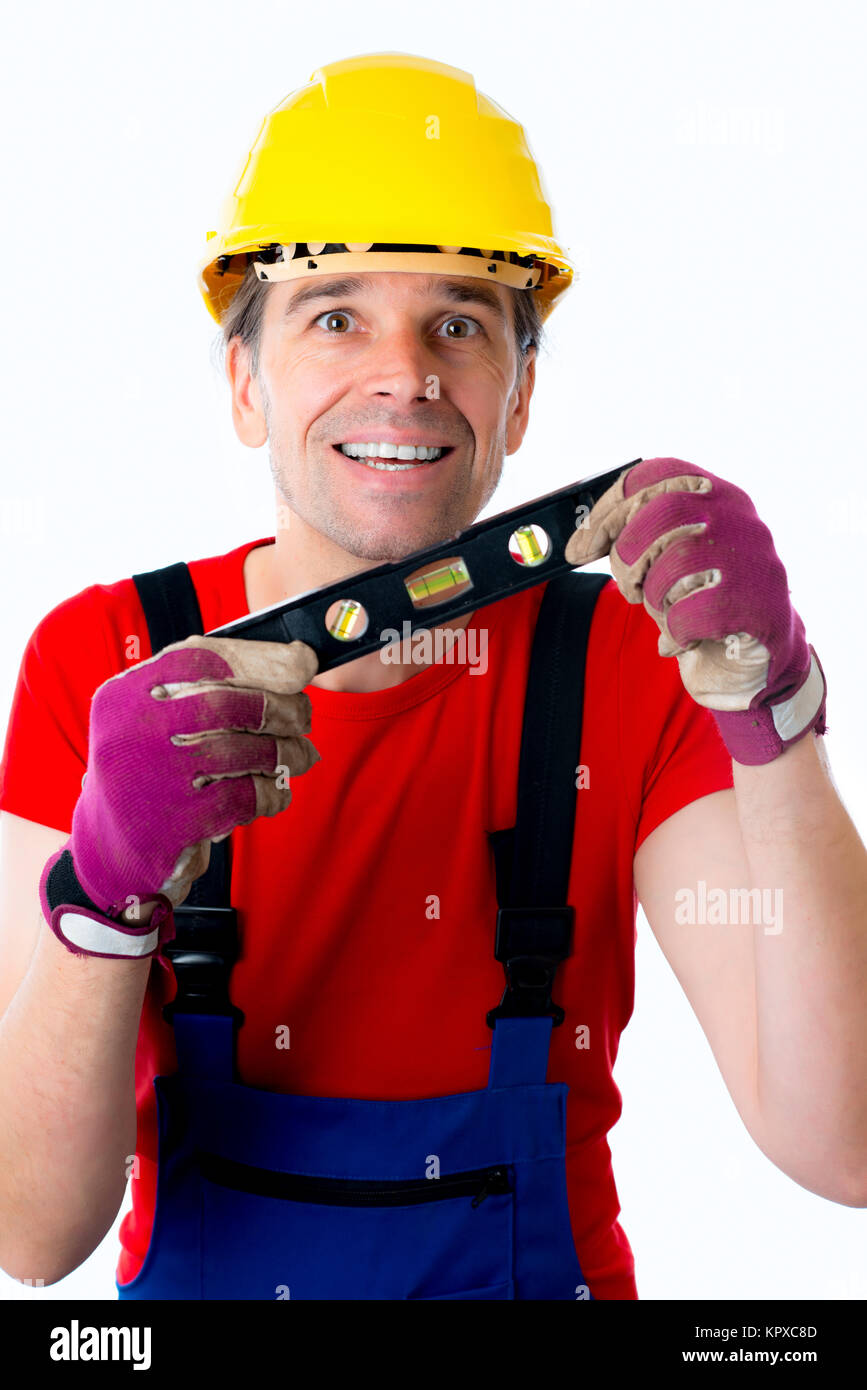 smiling worker is pointing at his water-level Stock Photo - Alamy