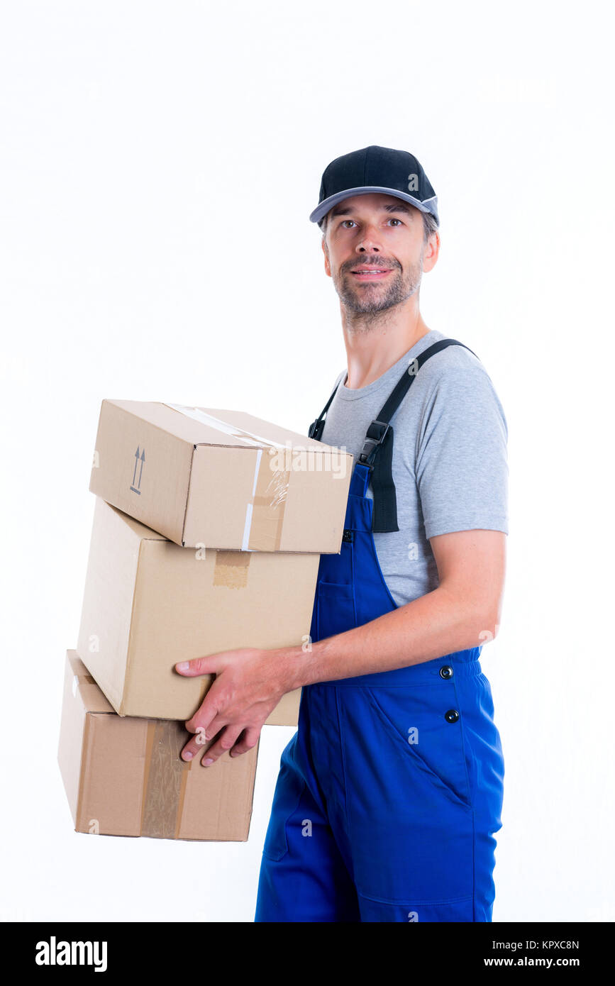 friendly postman with parcels in front of white background Stock Photo ...