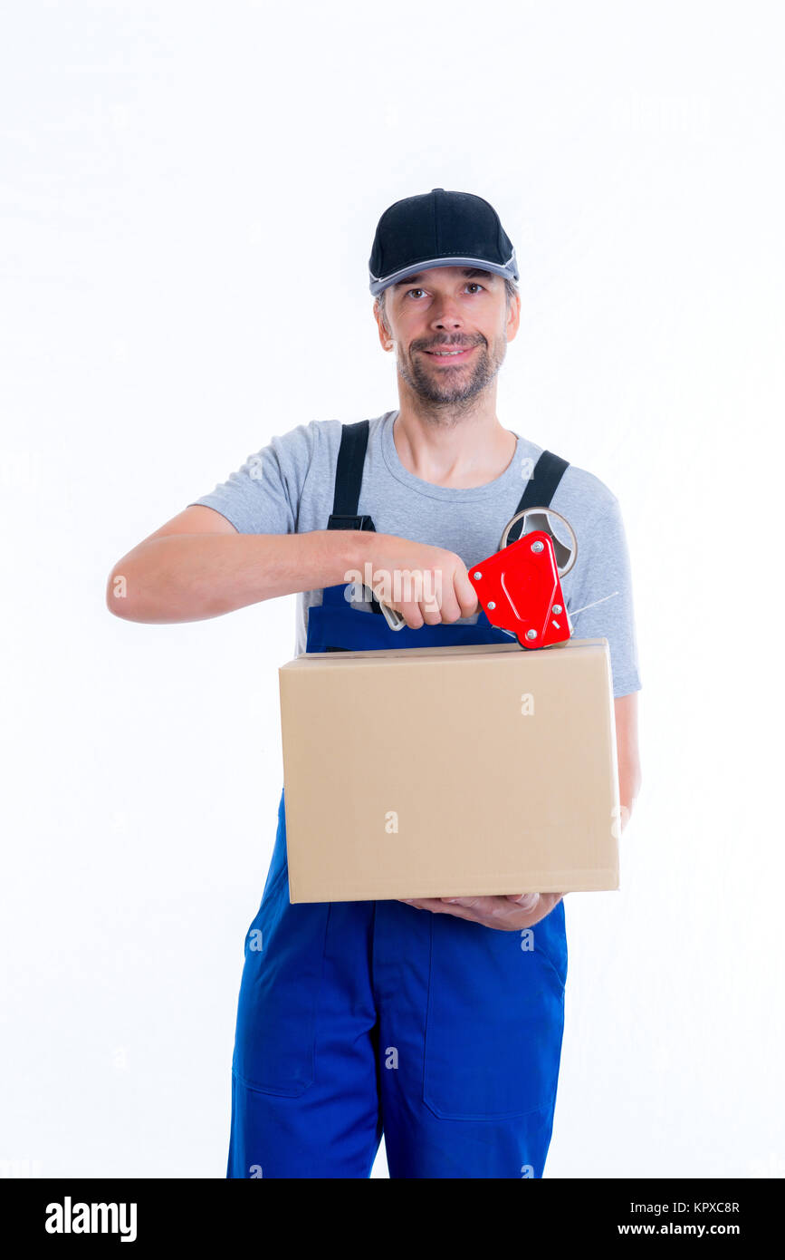 friendly postman with parcels in front of white background Stock Photo ...