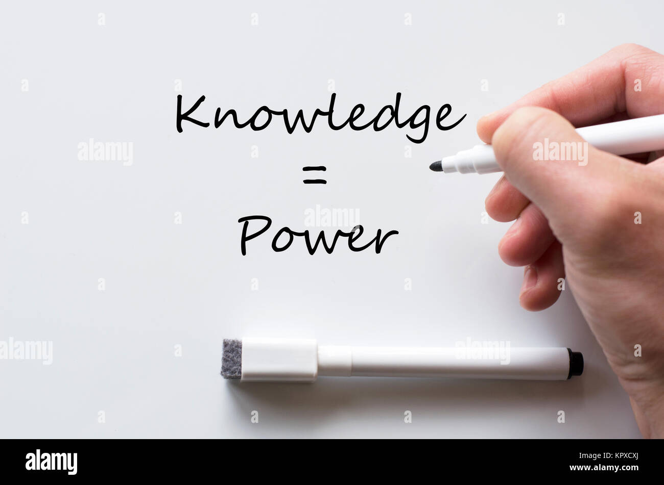 Knowledge and power written on whiteboard Stock Photo - Alamy