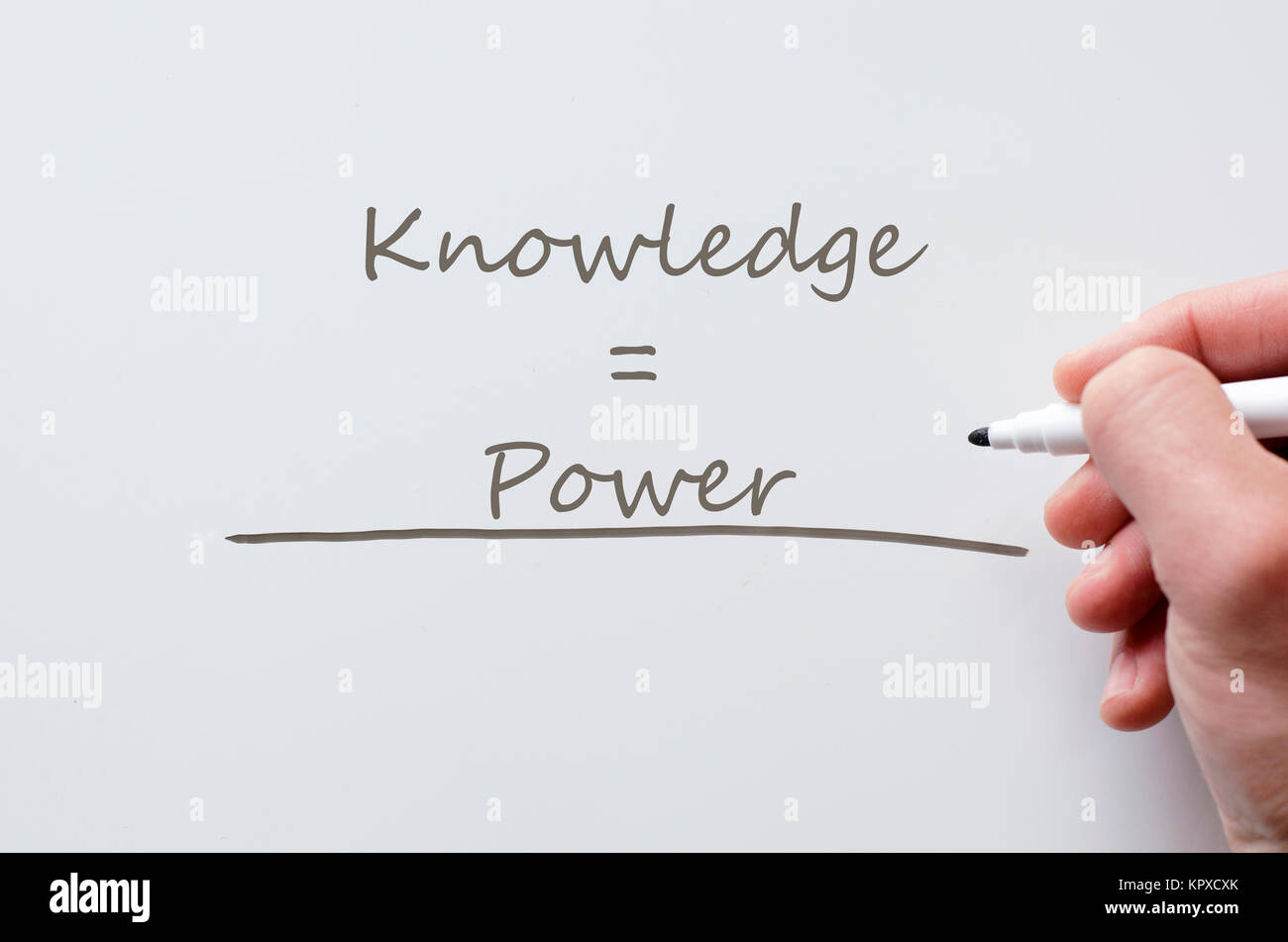 Knowledge and power written on whiteboard Stock Photo - Alamy
