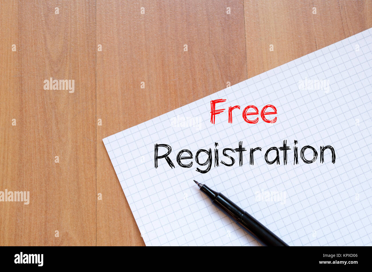 Free registration write on notebook Stock Photo - Alamy