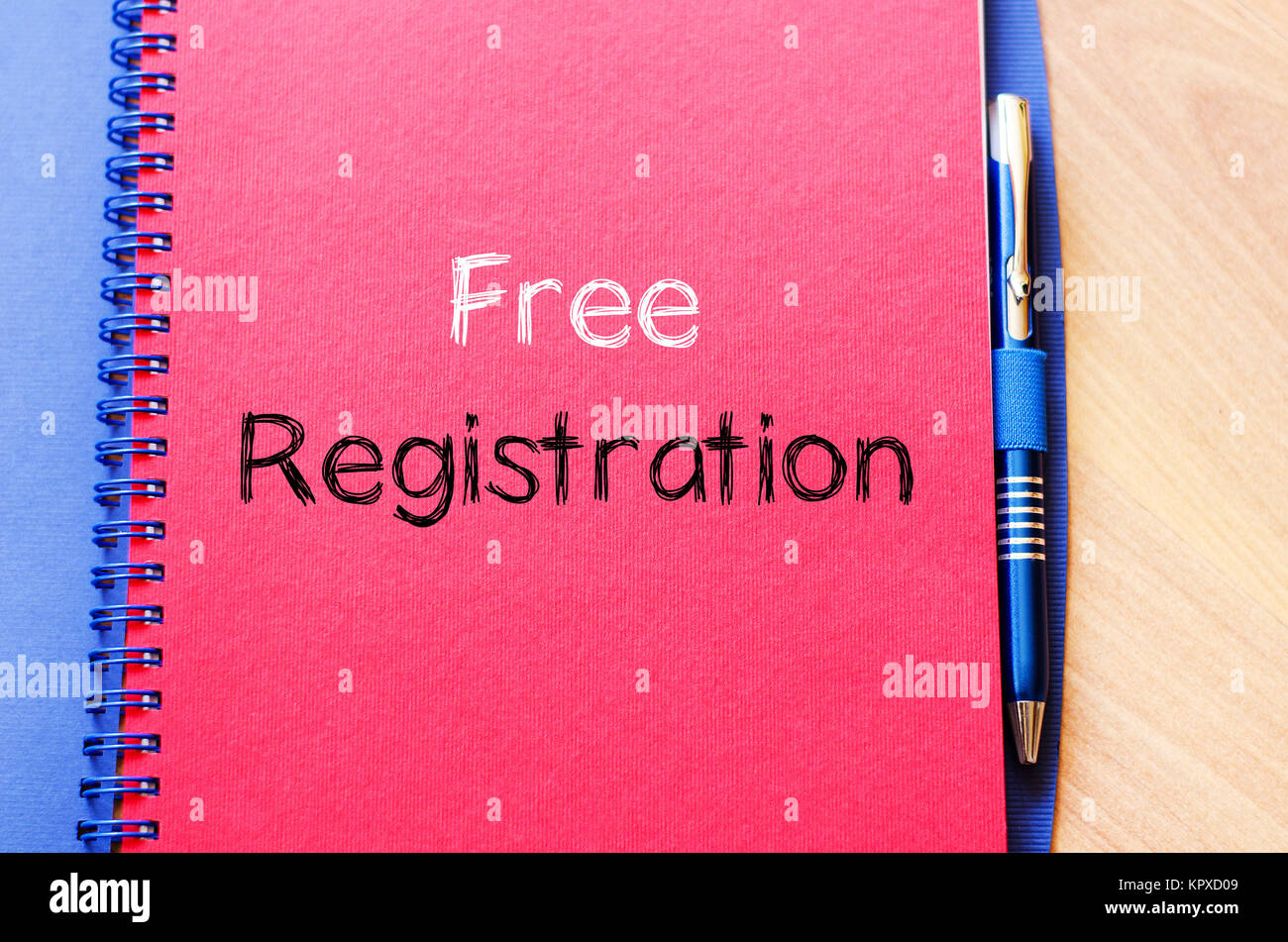 Free registration write on notebook Stock Photo - Alamy