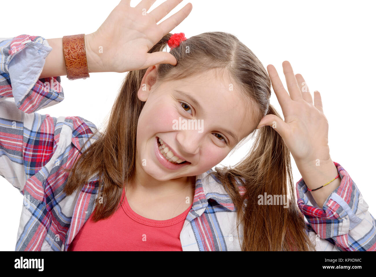 funny little girl making faces Stock Photo - Alamy
