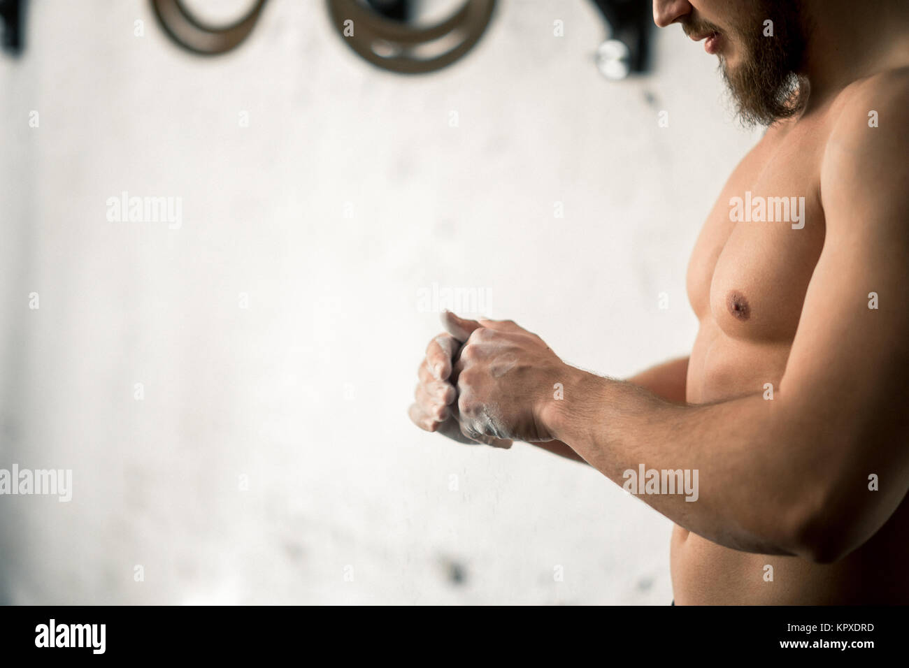 Athlete clapping hands with talc before deadlift barbells workout Stock ...