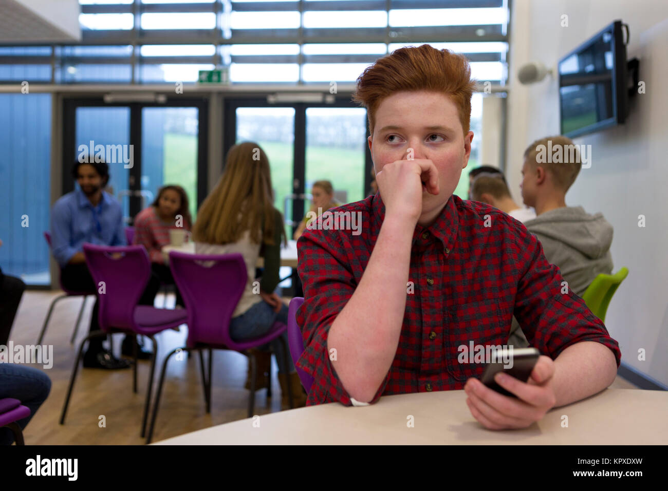 Stressed Student with Smartphone Stock Photo - Alamy