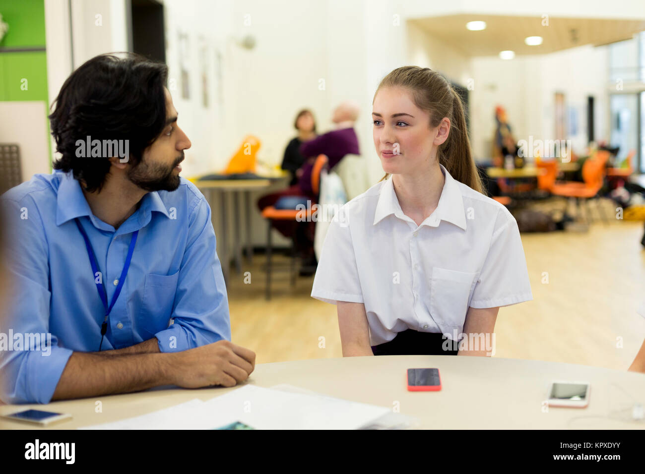 Teacher and Student Chatting Stock Photo - Alamy
