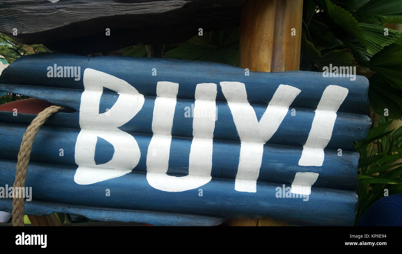 Blue buy sign on wooden block Stock Photo - Alamy