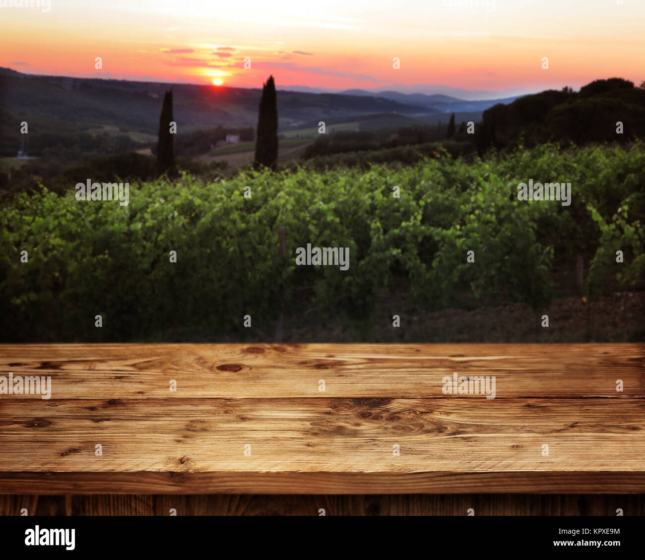 rustic wooden table in front of a vineyard Stock Photo - Alamy