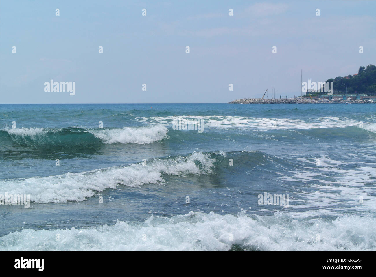 Raging sea under blue sky Stock Photo - Alamy