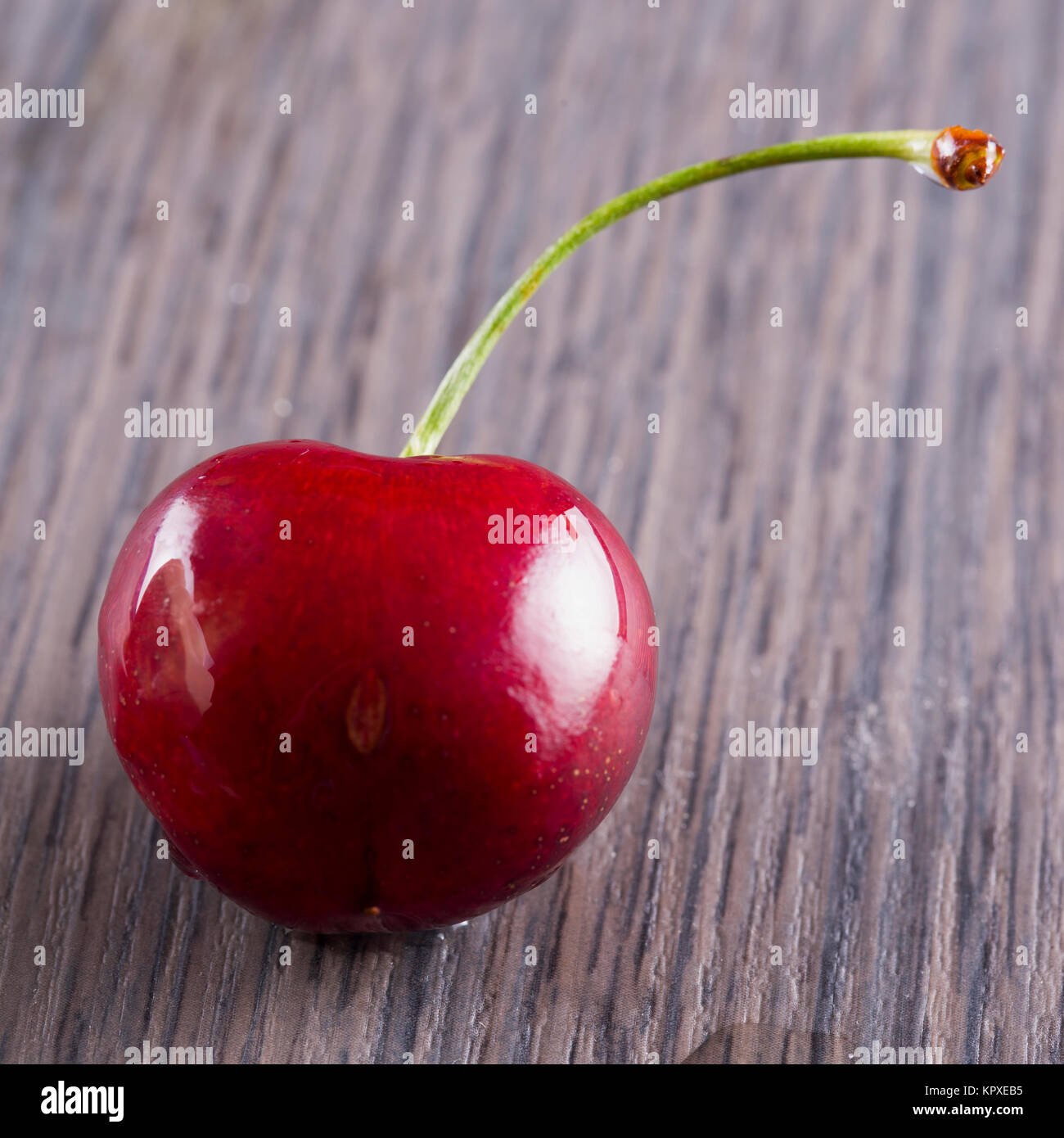 Cherry over table Stock Photo - Alamy