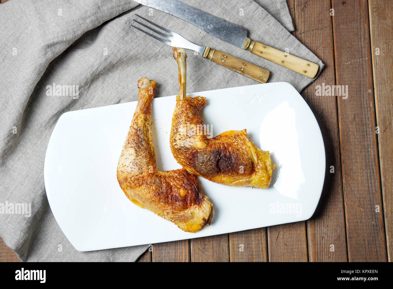two roasted chicken drumstick Stock Photo - Alamy