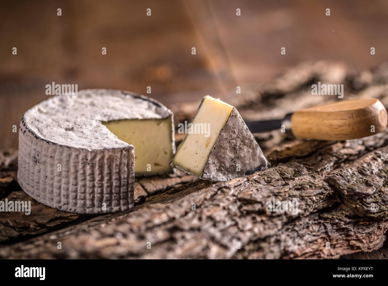 Camembert cheese slice Stock Photo - Alamy