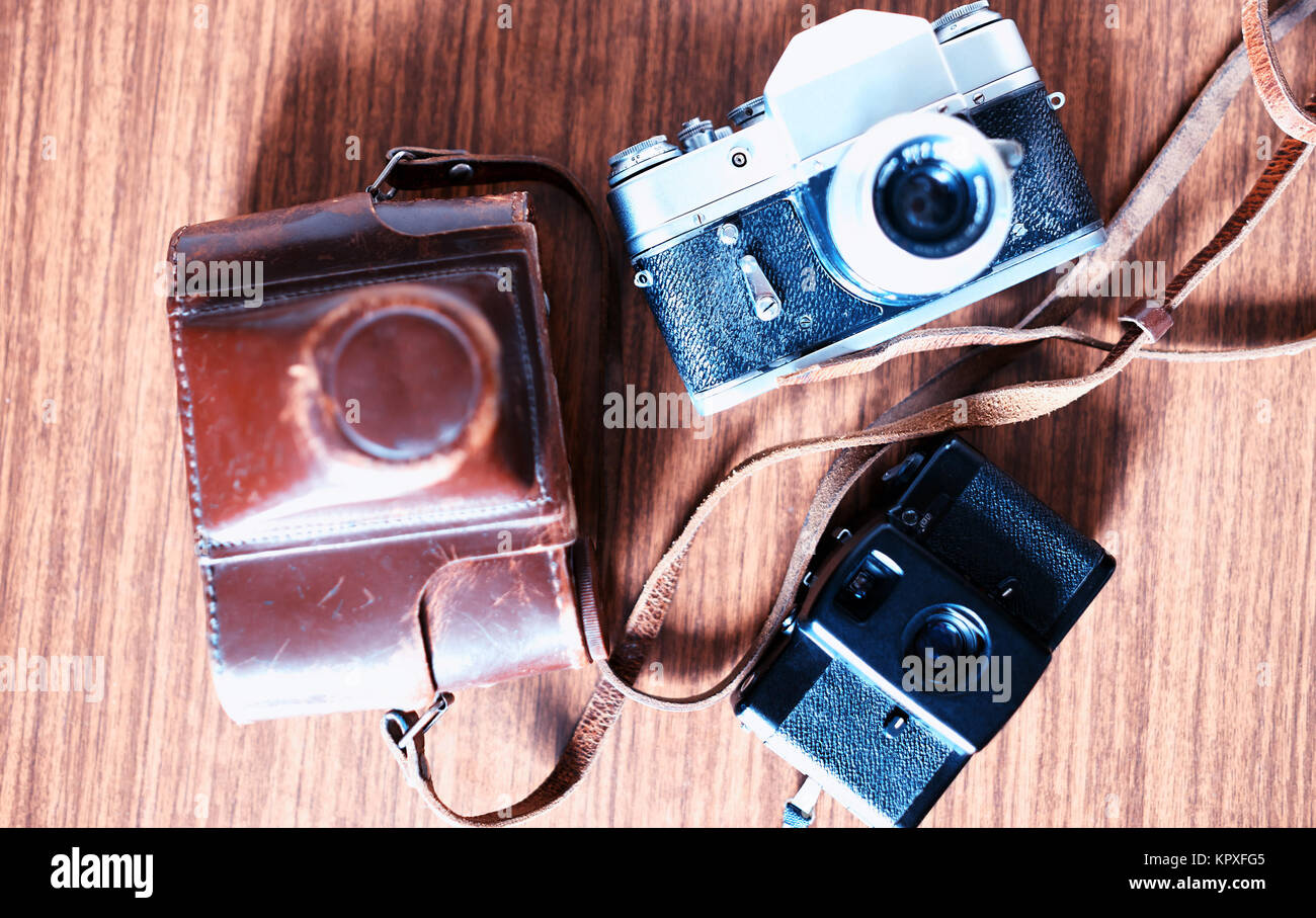 Three vinage cameras view from top background Stock Photo - Alamy