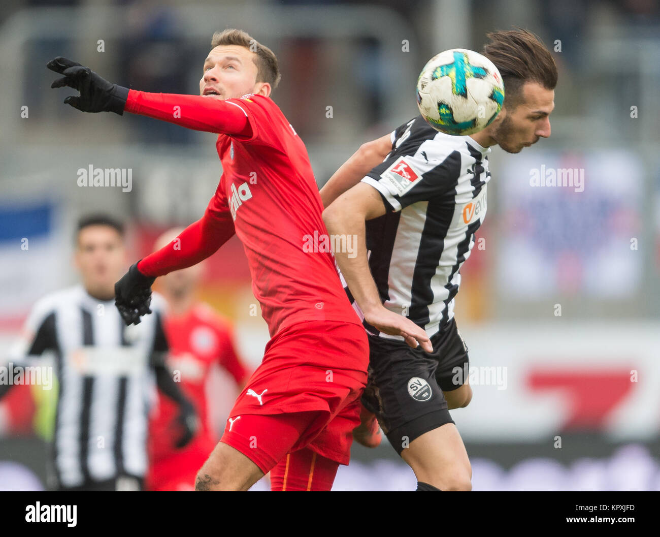 Sandhausen's Leart Paqarada (R) and Kiel's Tom Weilandt vying for the ...