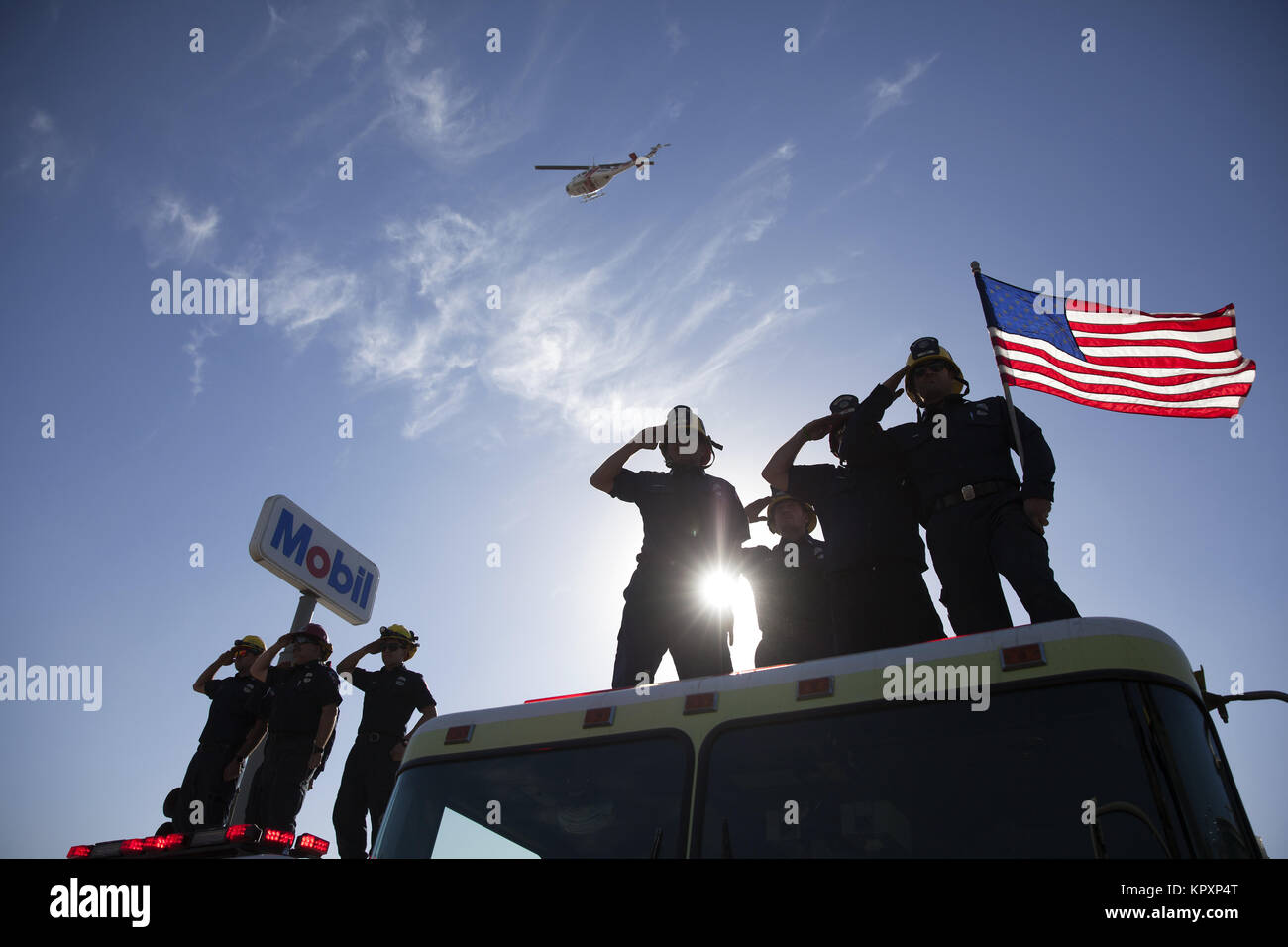 December 17, 2017 - Ventura, California, U.S - Firefighters salute as a ...