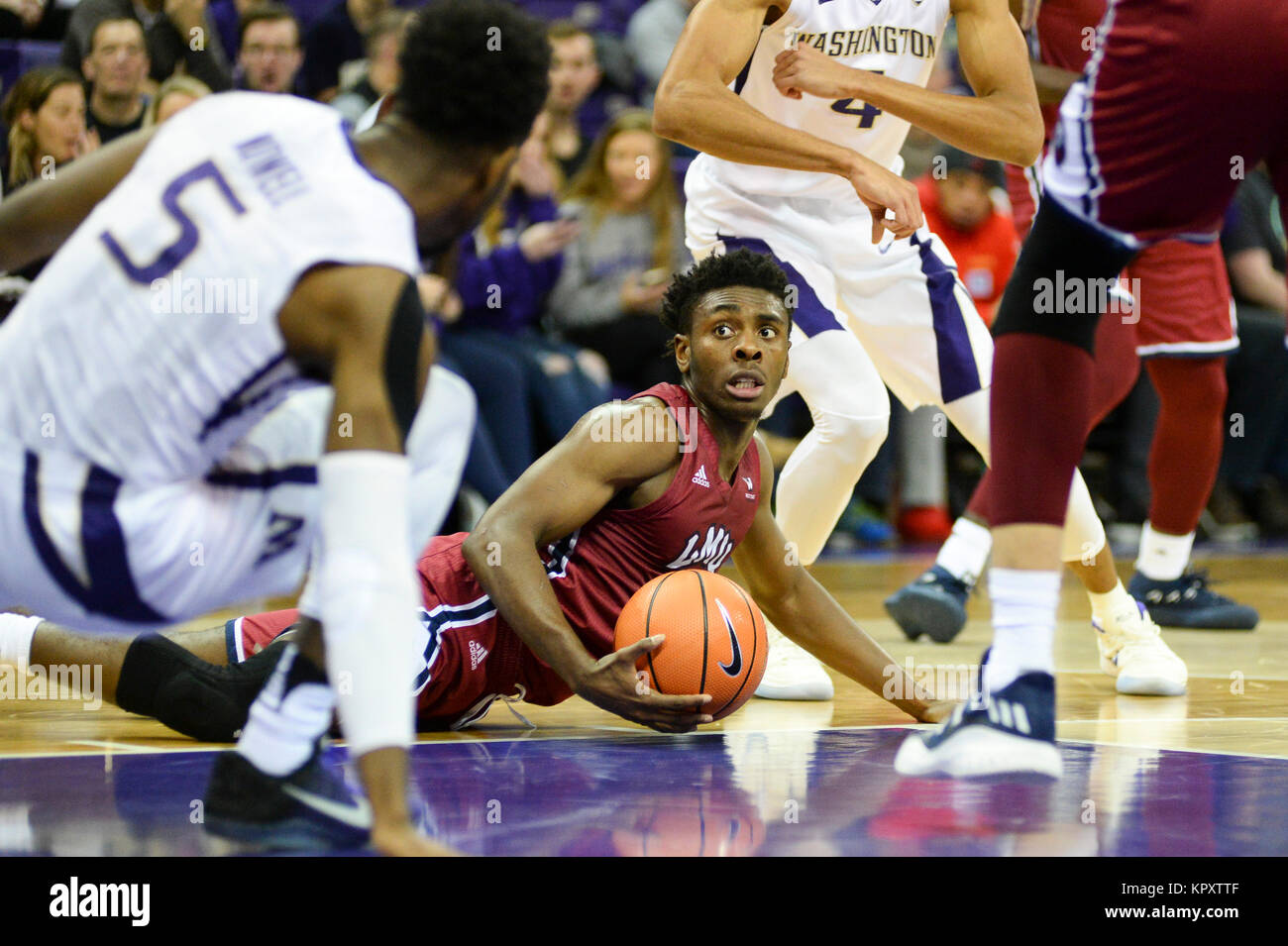Seattle, WA, USA. 17th Dec, 2017. LMU guard James Batemon (5) looks to ...