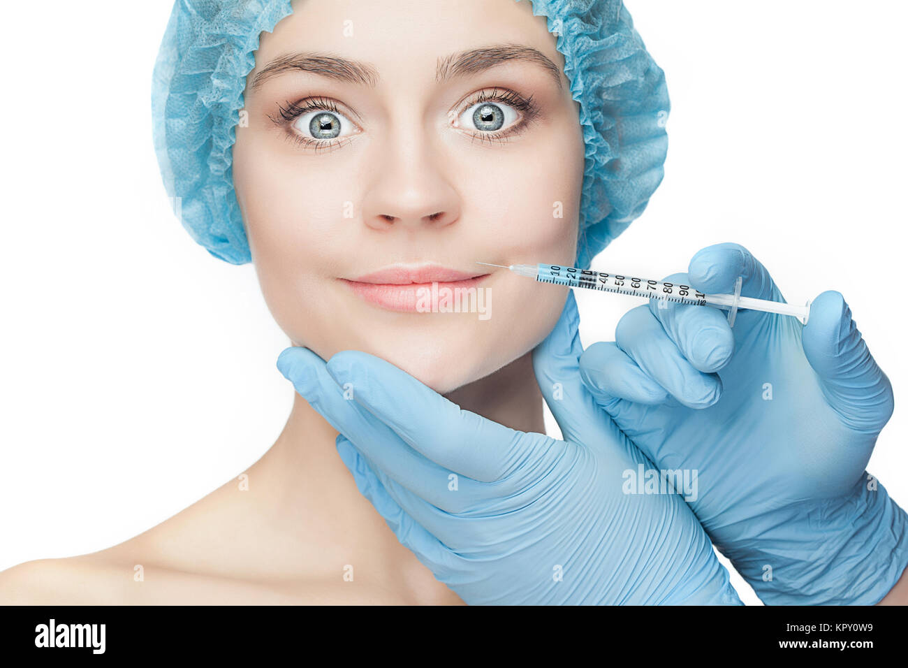 Attractive woman at plastic surgery with syringe in her face Stock ...