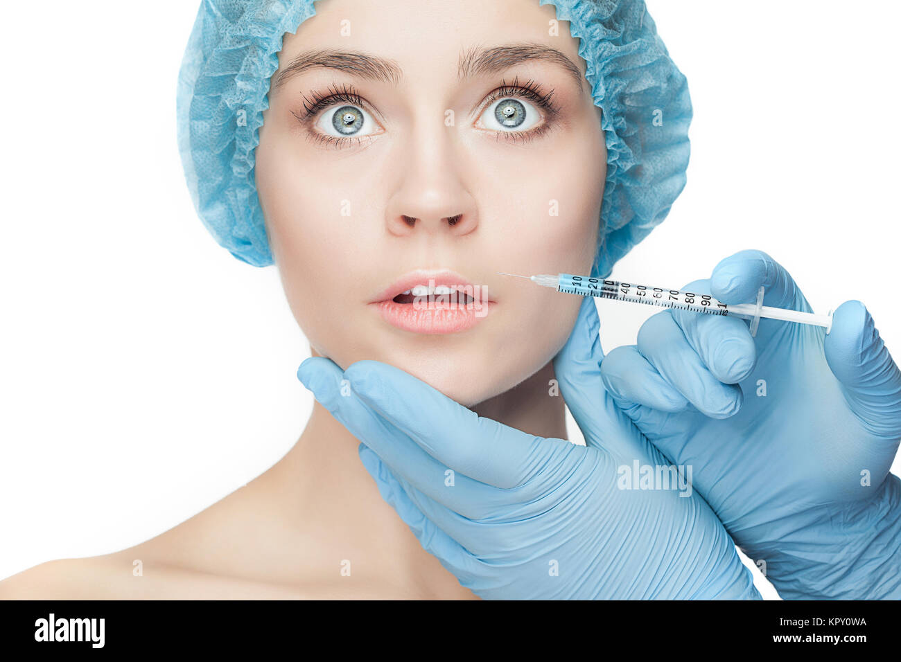 Attractive woman at plastic surgery with syringe in her face Stock ...