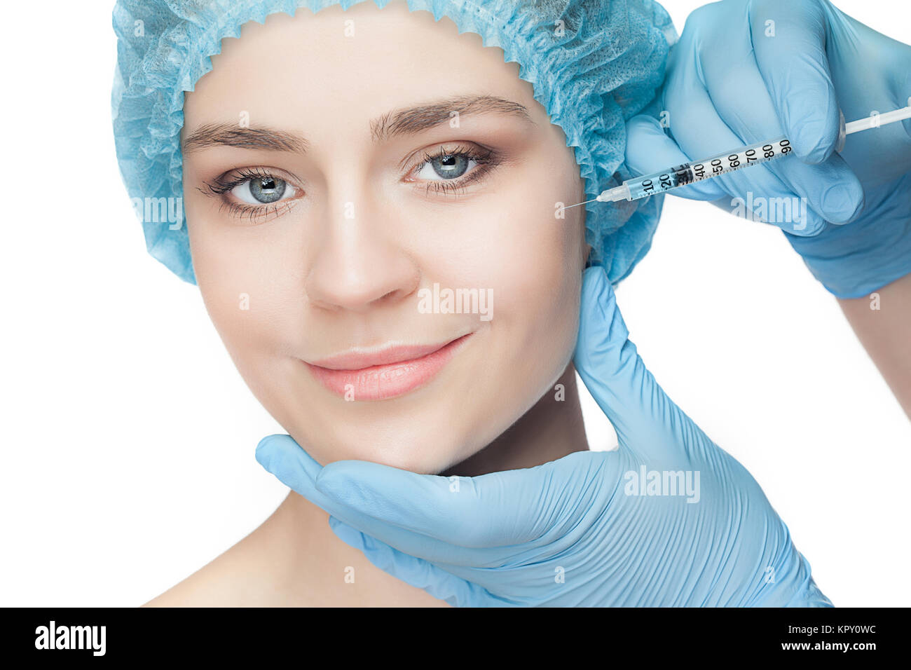 Attractive woman at plastic surgery with syringe in her face Stock ...