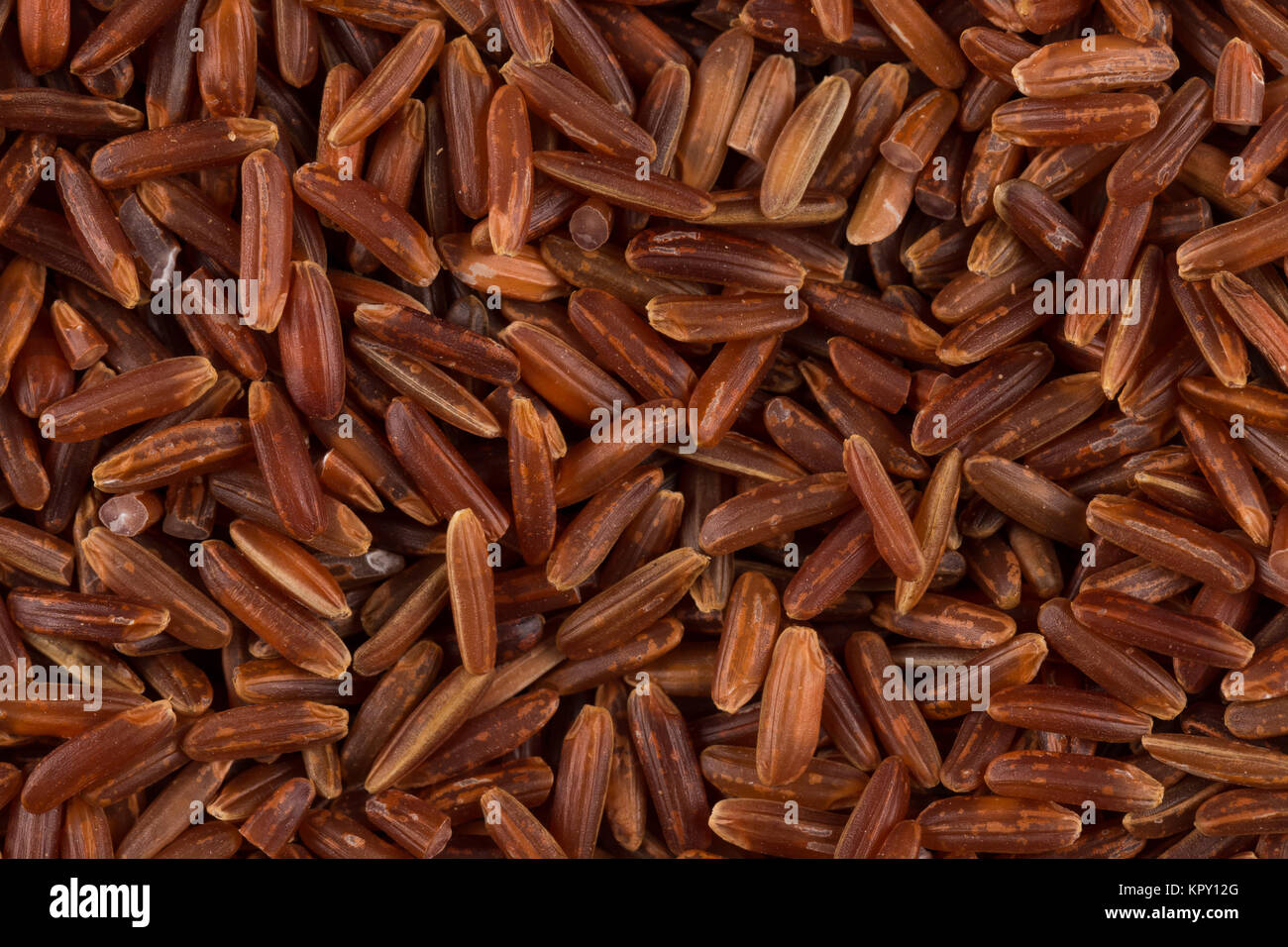 Raw red rice Stock Photo - Alamy