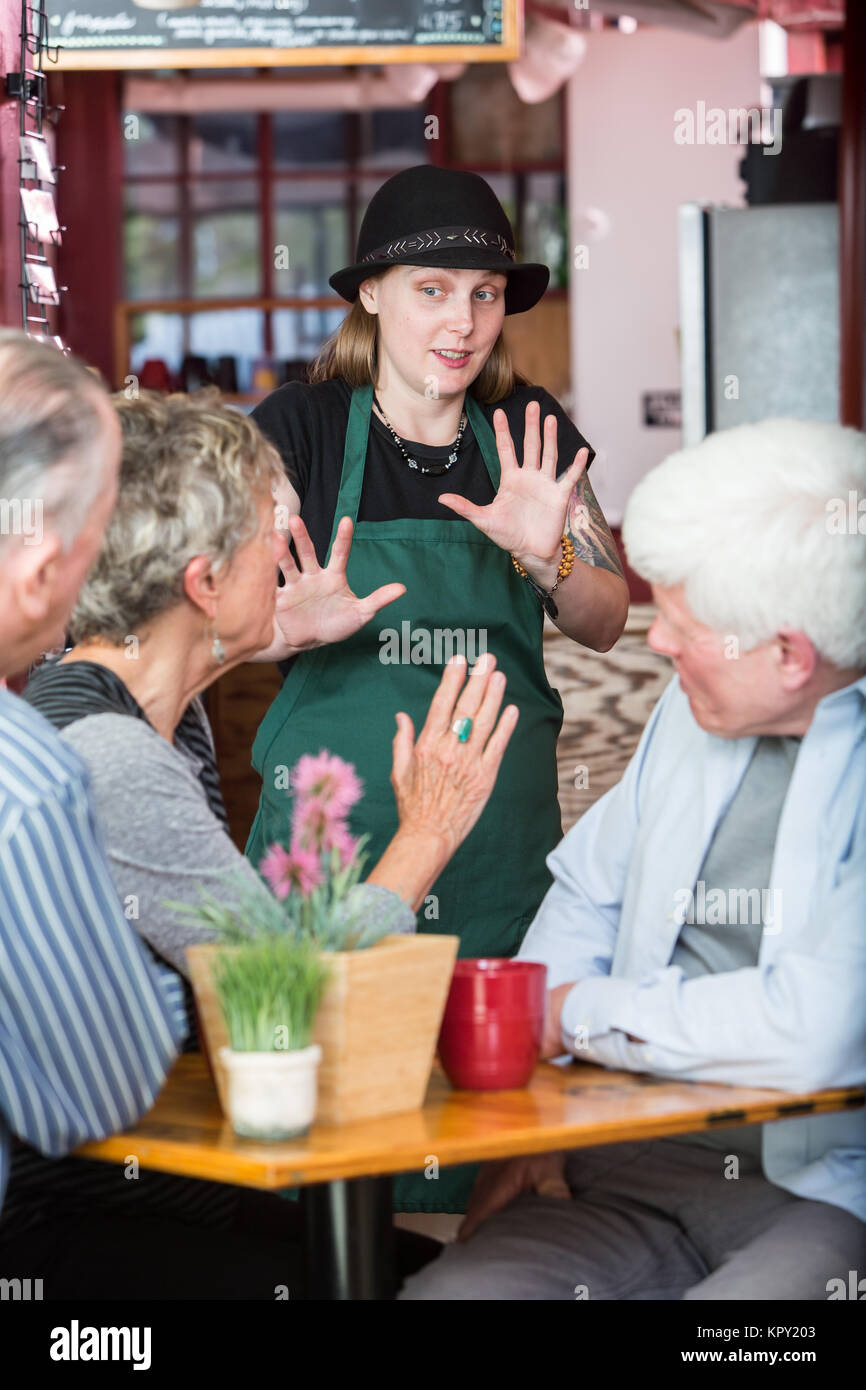 Angry Customers and Defensive Worker Stock Photo - Alamy