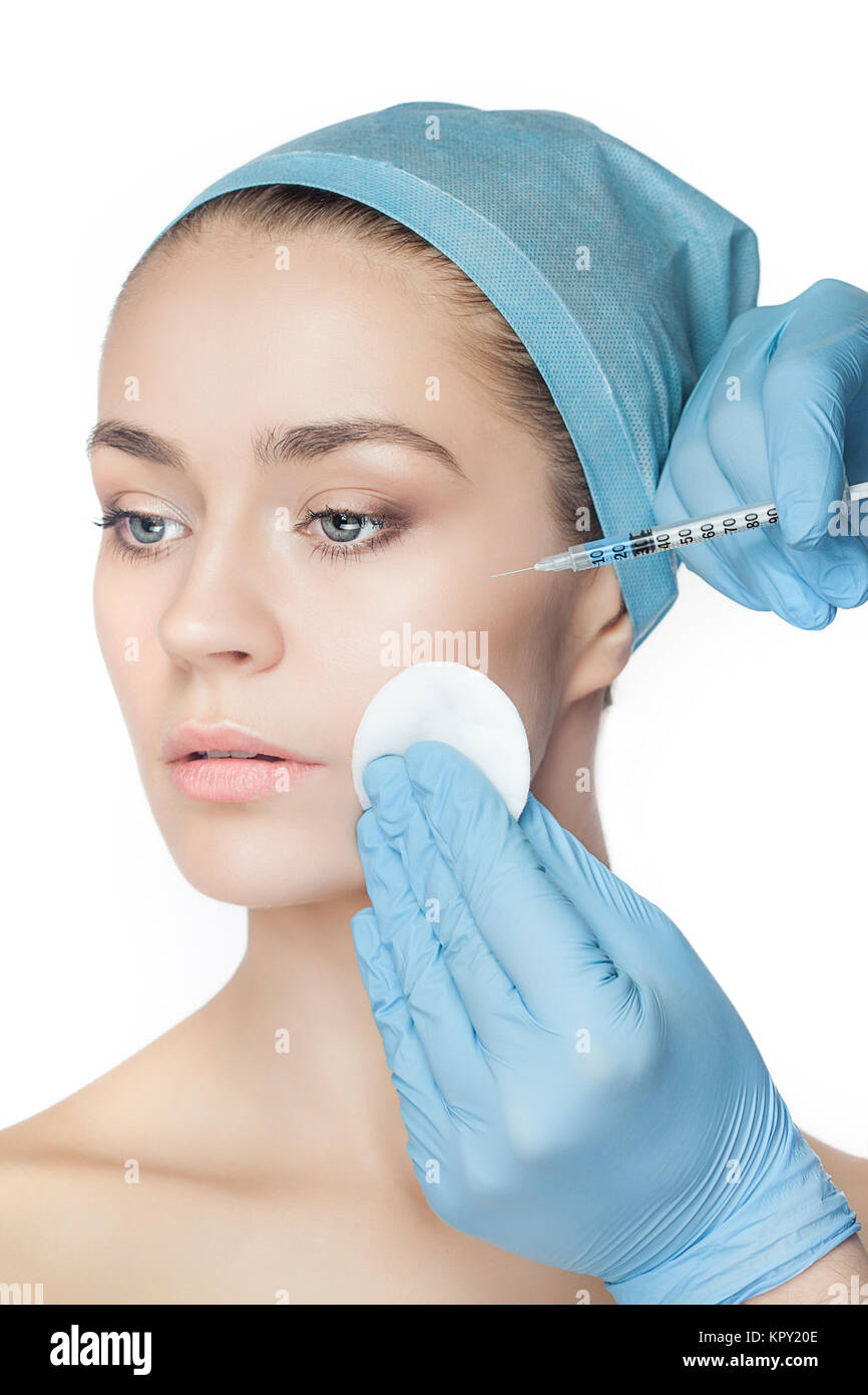 Attractive woman at plastic surgery with syringe in her face Stock ...
