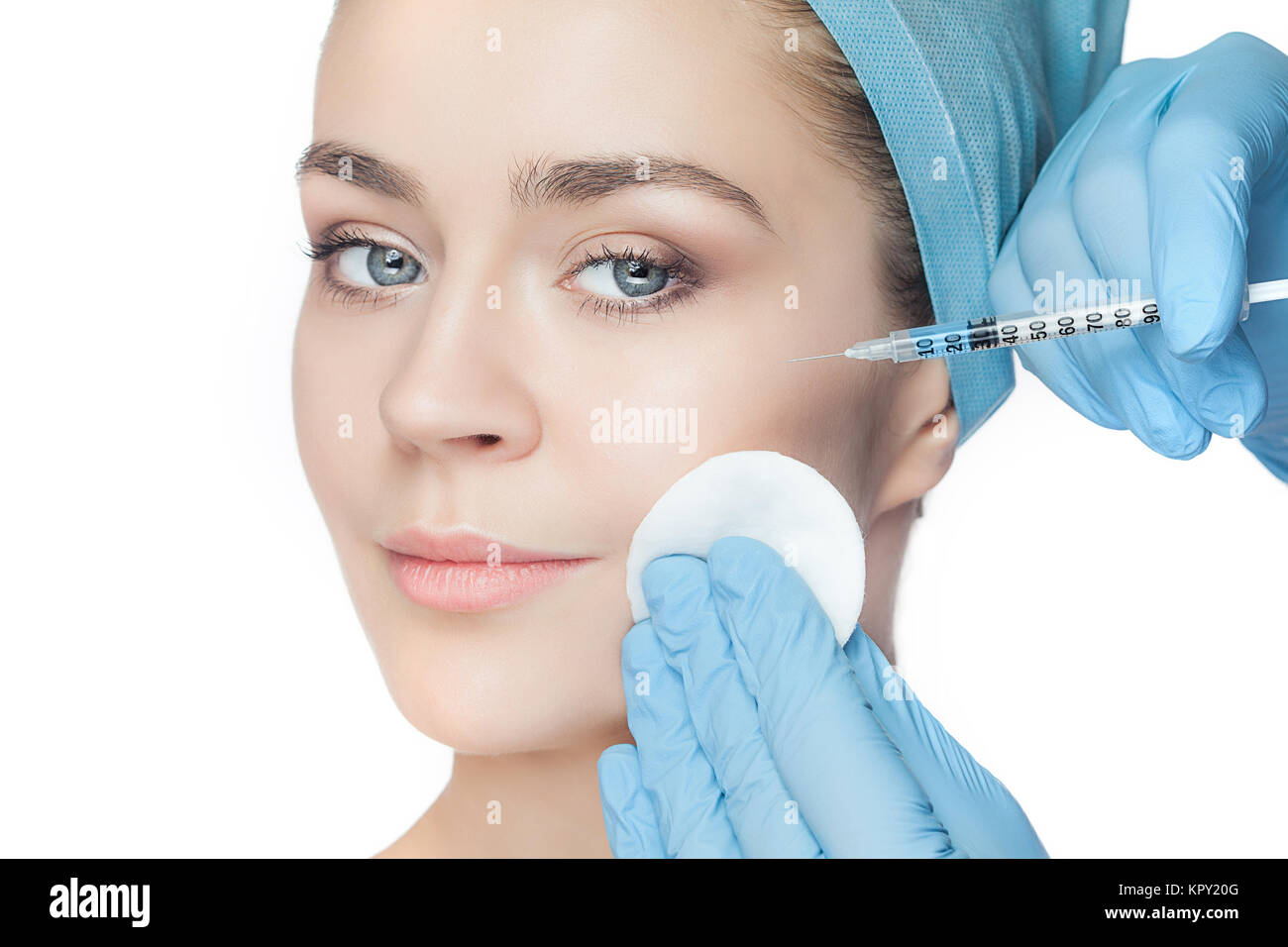 Attractive woman at plastic surgery with syringe in her face Stock ...
