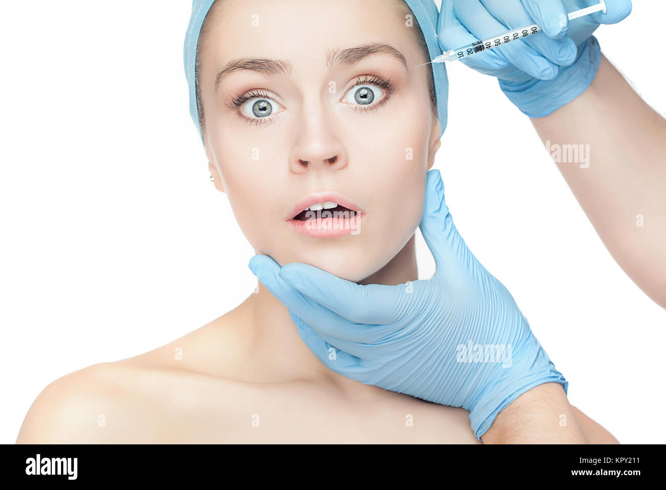 Attractive woman at plastic surgery with syringe in her face Stock ...