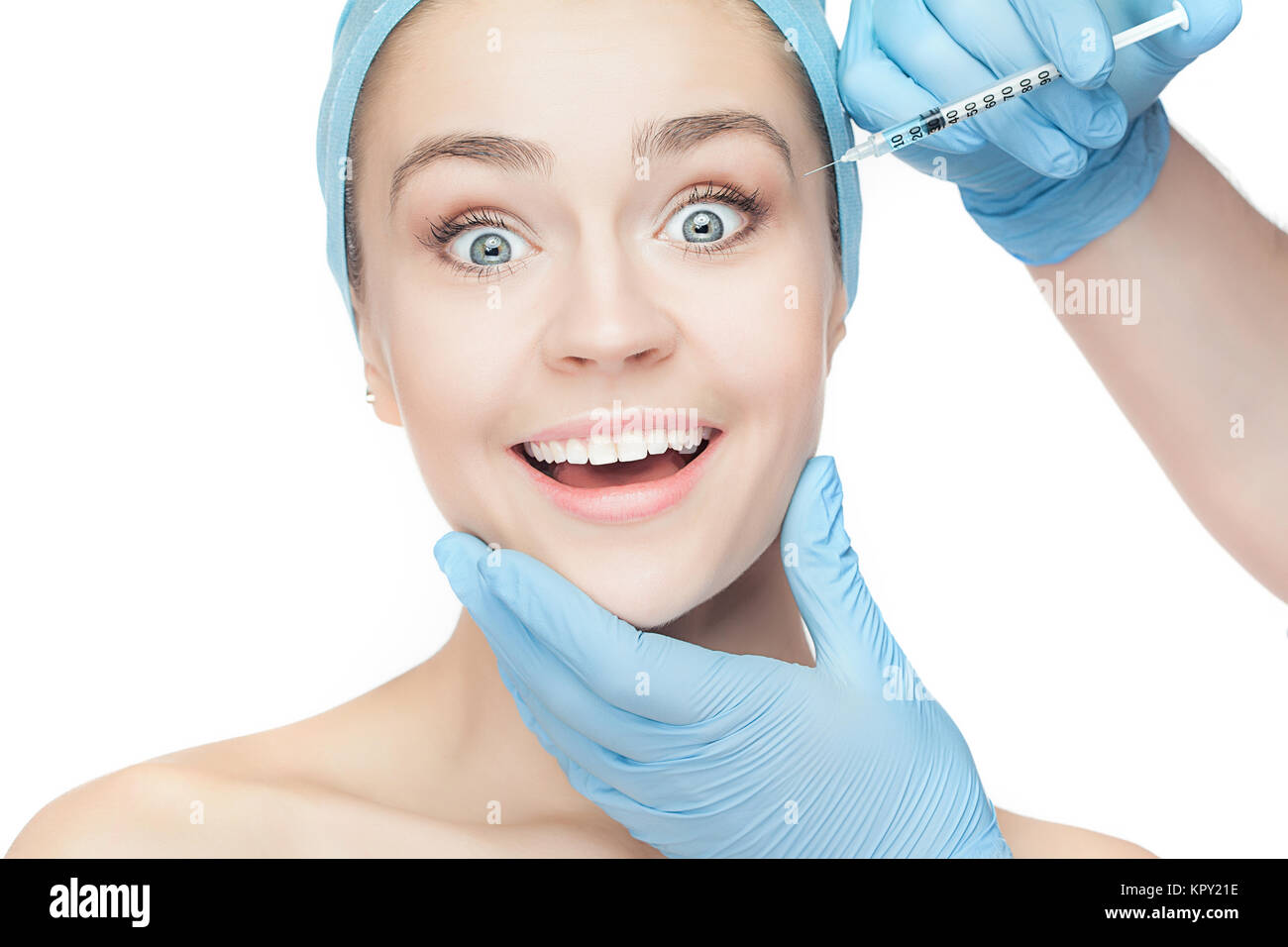 Attractive woman at plastic surgery with syringe in her face Stock ...