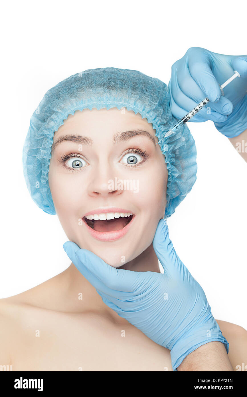 Attractive woman at plastic surgery with syringe in her face Stock ...