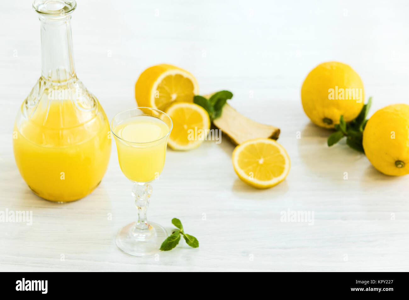 Italian traditional liqueur limoncello with lemon Stock Photo - Alamy