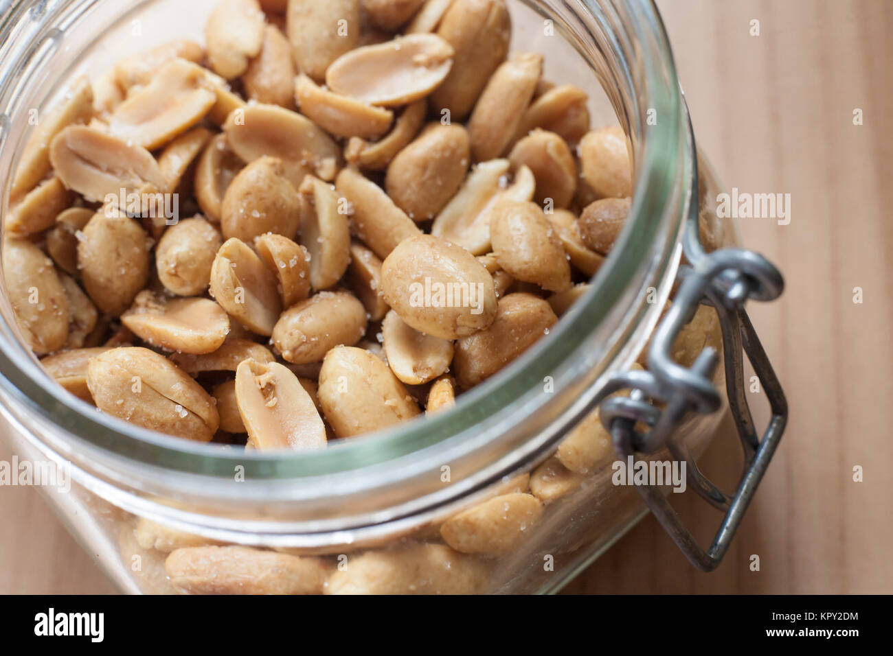 Open canning jar with fried salty peanuts. Overhead view Stock Photo ...