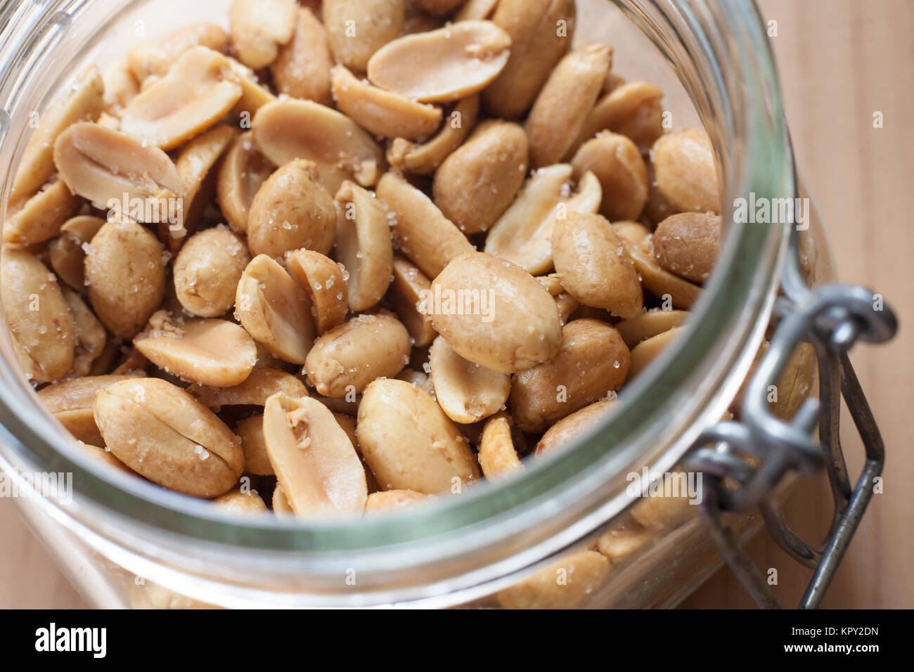 Open canning jar with fried salty peanuts. Overhead view Stock Photo ...