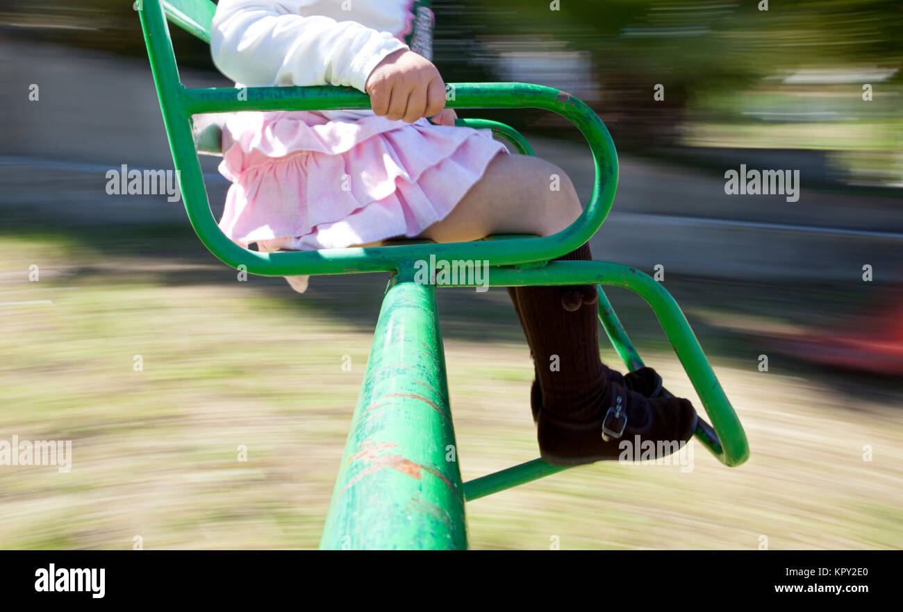 Having fun on the roundabout Stock Photo - Alamy