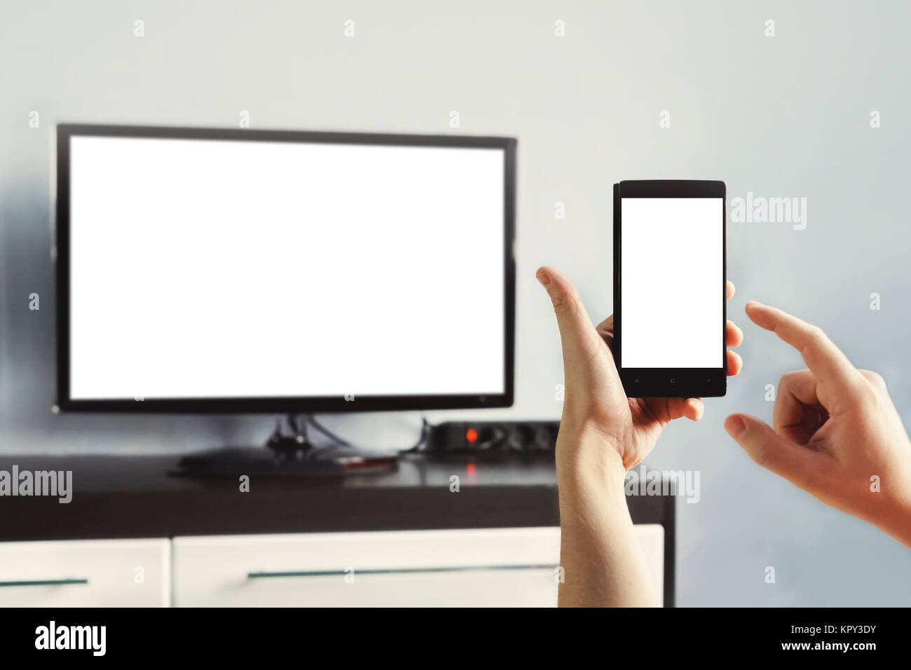 Young adult man hand tap on white screen smartphone with white screen ...