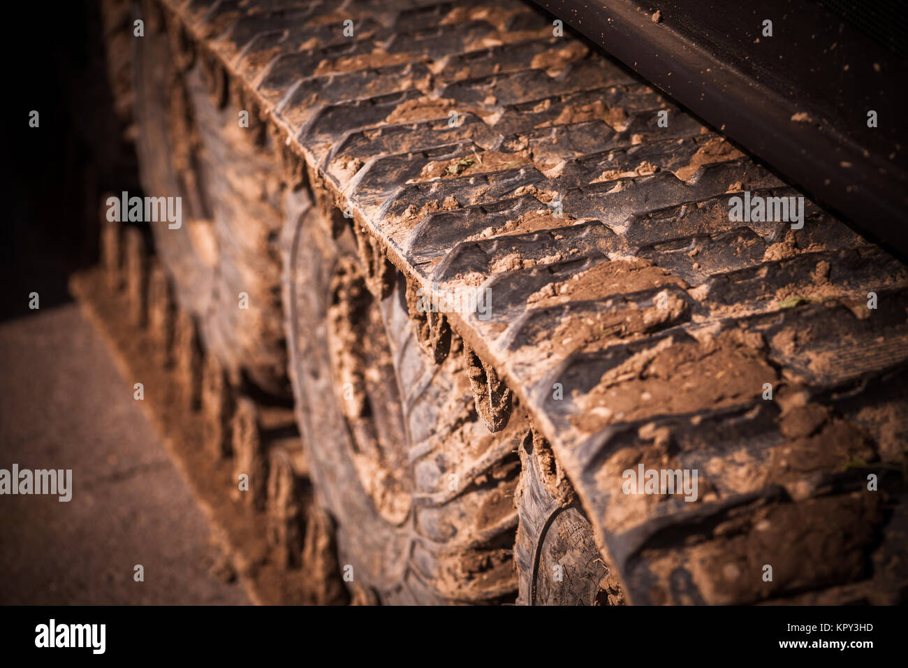 Muddy caterpillar track Stock Photo - Alamy