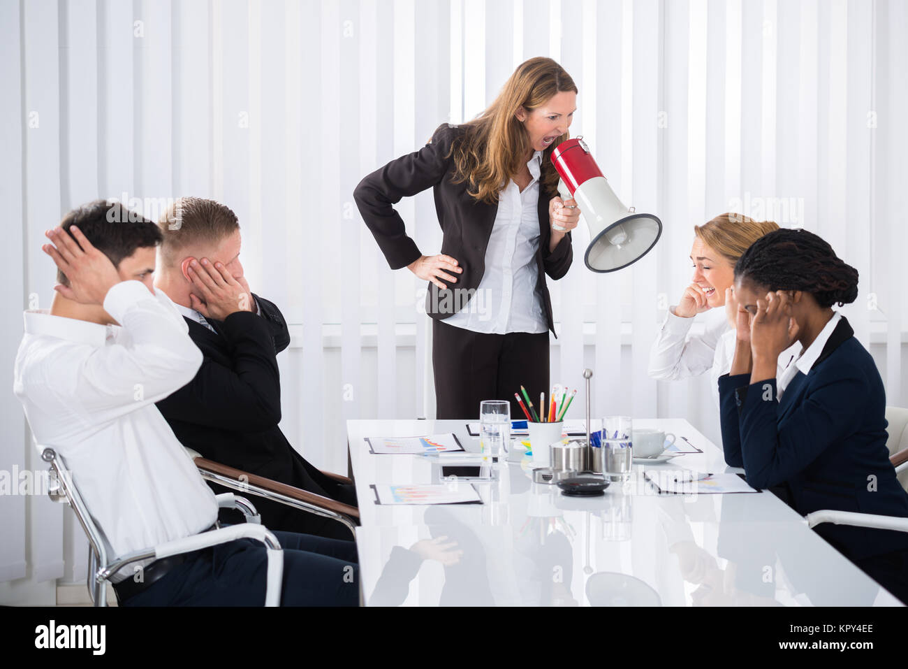 Businesswoman Shouting Through Megaphone Stock Photo - Alamy