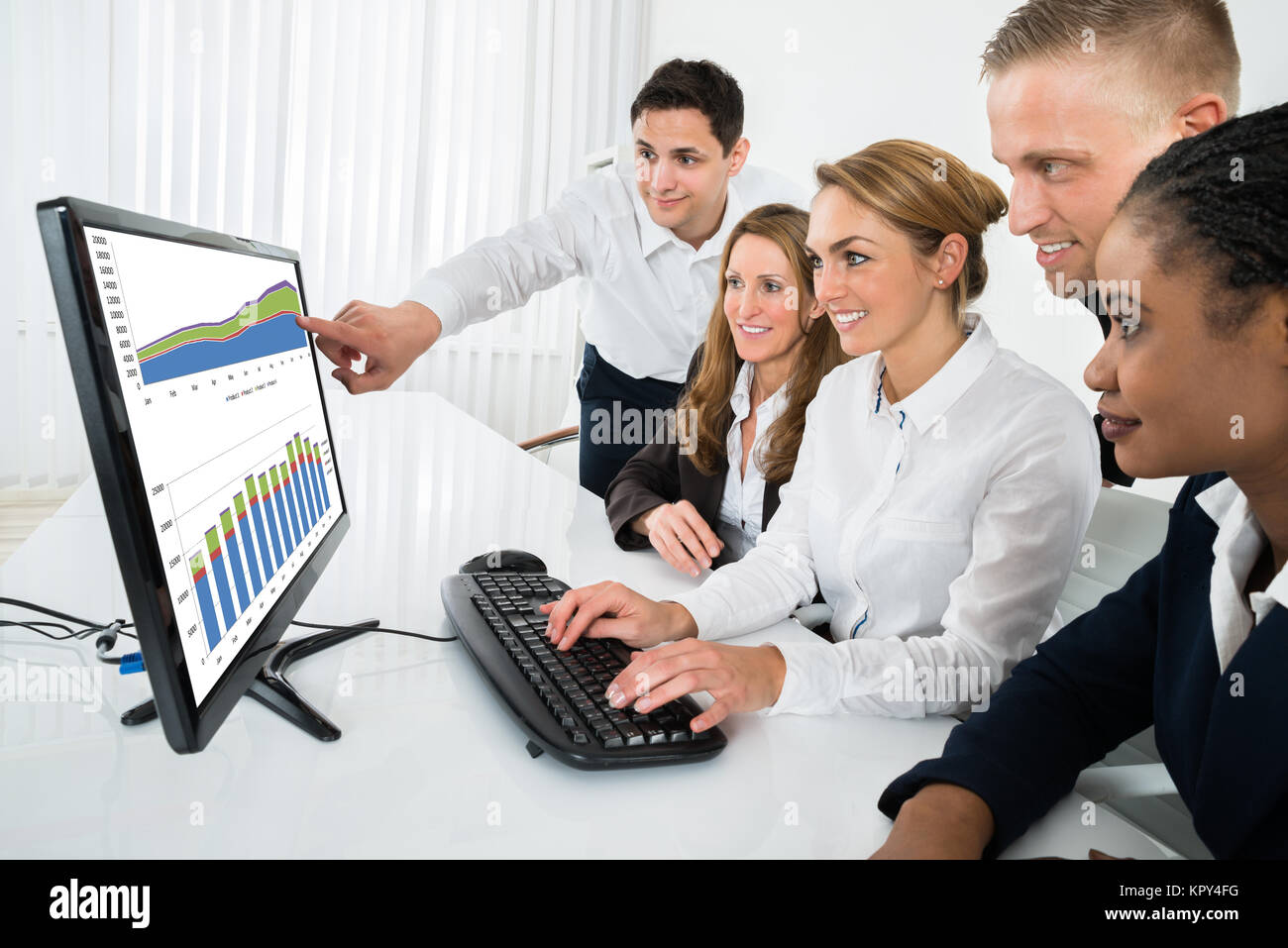 Businesspeople Looking At Graph On Computer Stock Photo - Alamy Businesspeople Looking At Graph On Computer Stock Photo - Alamy