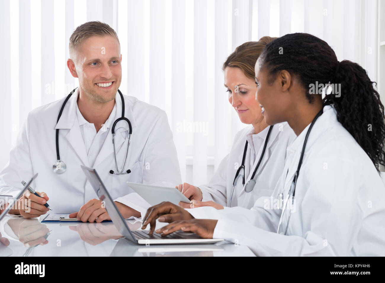 Group Of Doctors In Meeting Stock Photo - Alamy