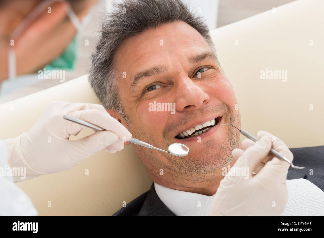 Man Having Dental Check-up In Clinic Stock Photo - Alamy