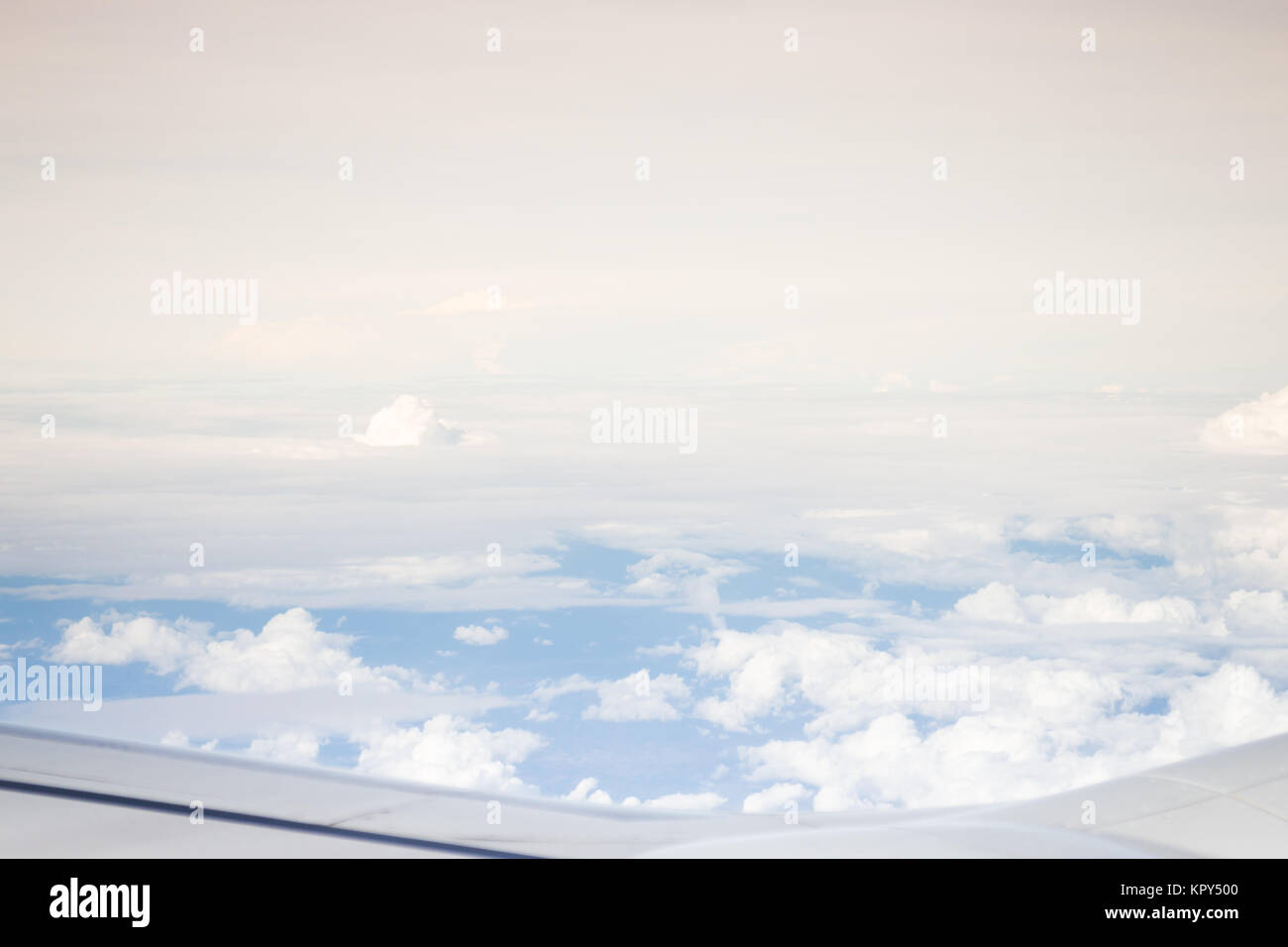 Cloudy sky view from airplane cabin window Stock Photo - Alamy