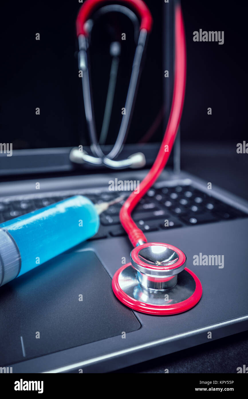 Stethoscope on laptop Stock Photo - Alamy
