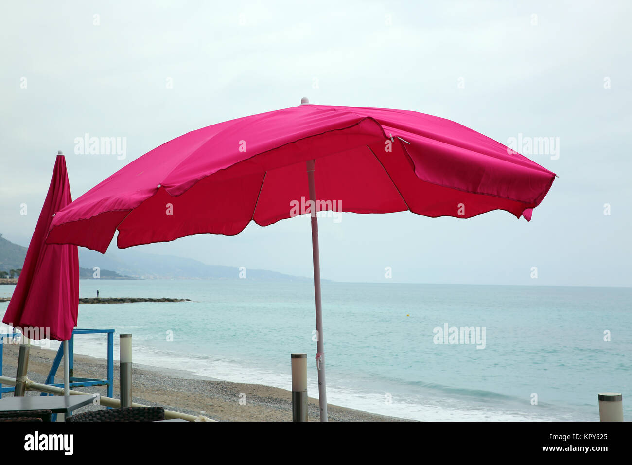 Pink Parasol By The Sea Stock Photo - Alamy