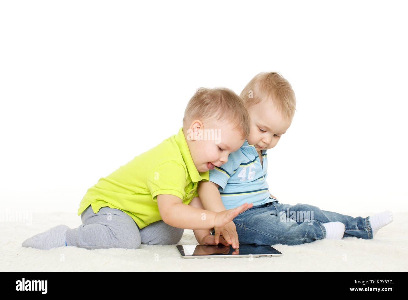 Small children with computer tablet Stock Photo - Alamy