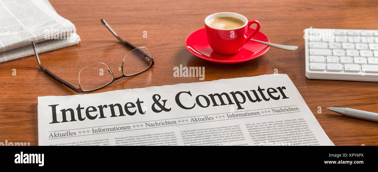 newspaper on the desk - internet and computer Stock Photo - Alamy