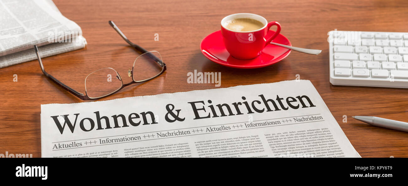 newspaper on desk - living and setting up Stock Photo - Alamy