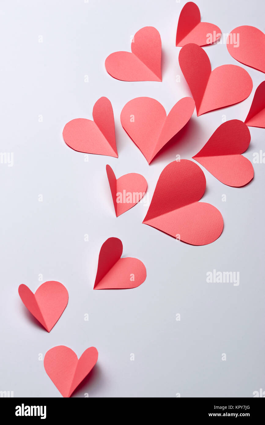 Beautiful pink paper hearts on white paper background Stock Photo - Alamy