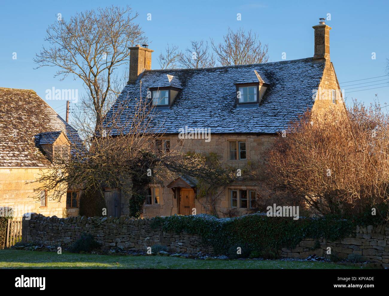 Cotswold country cottage with light snow Stock Photo - Alamy