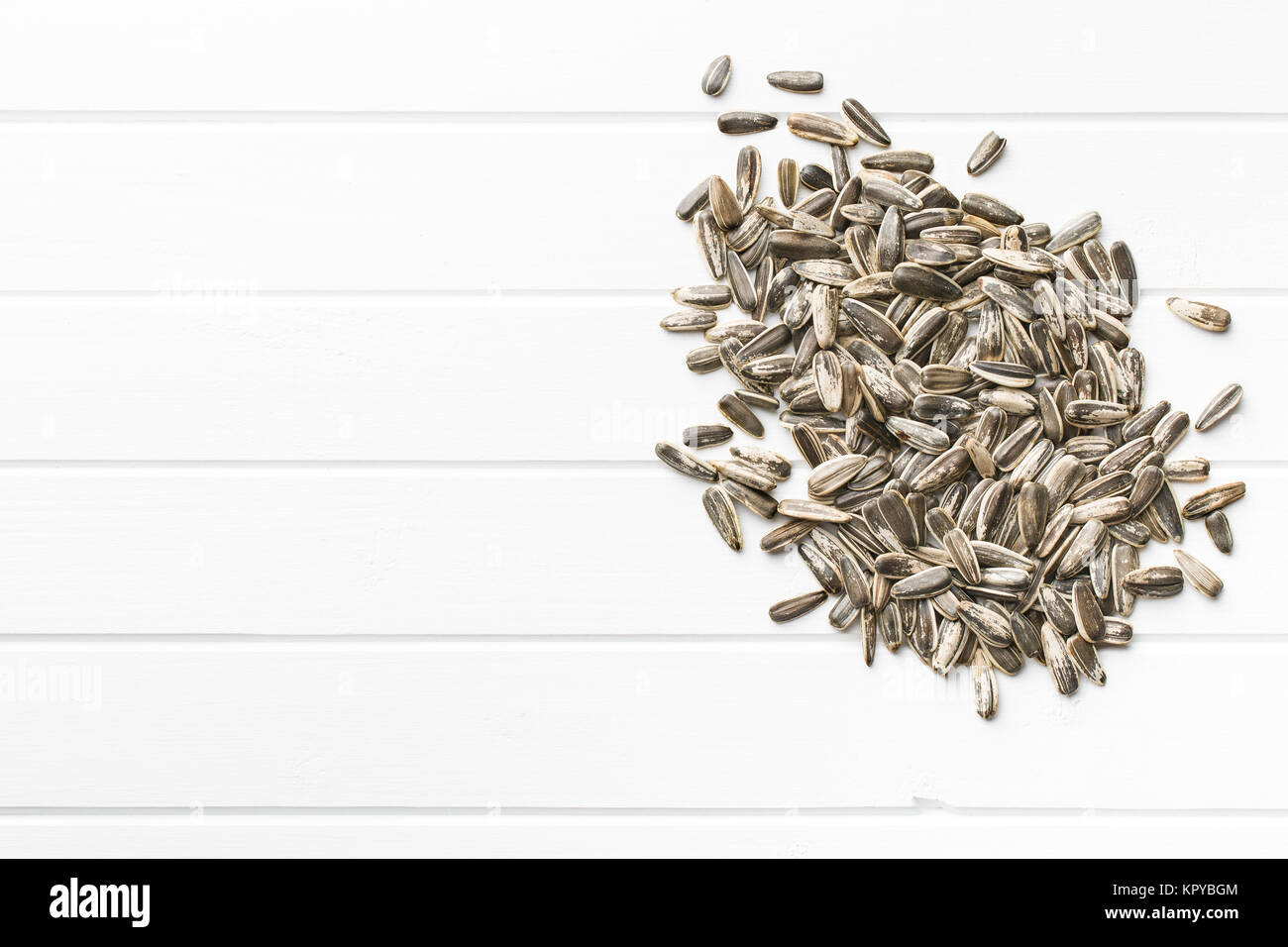 Unpeeled sunflower seeds Stock Photo - Alamy